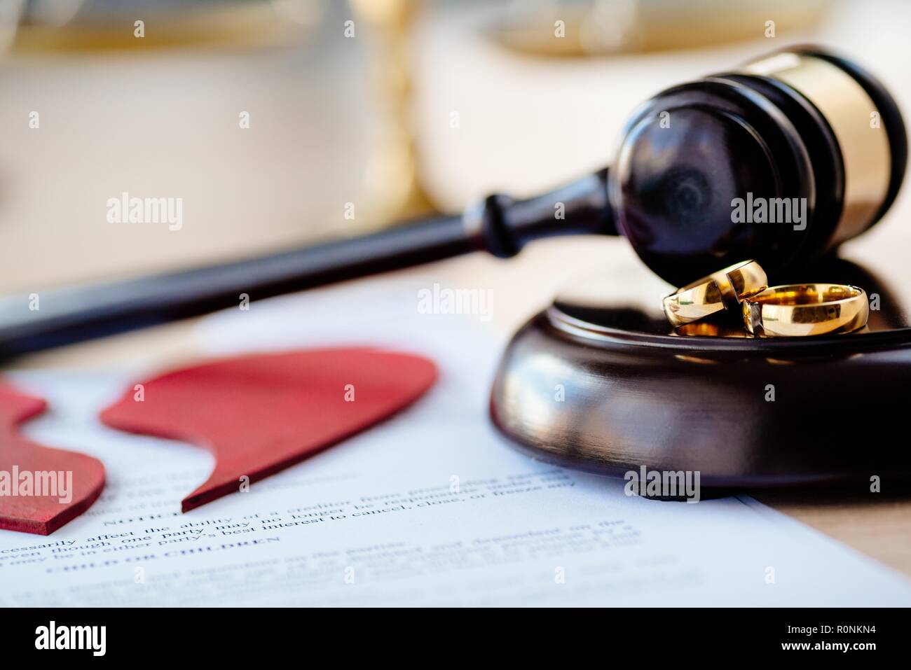 Two broken wedding rings on judge gavel. Divorce, separation and family ...