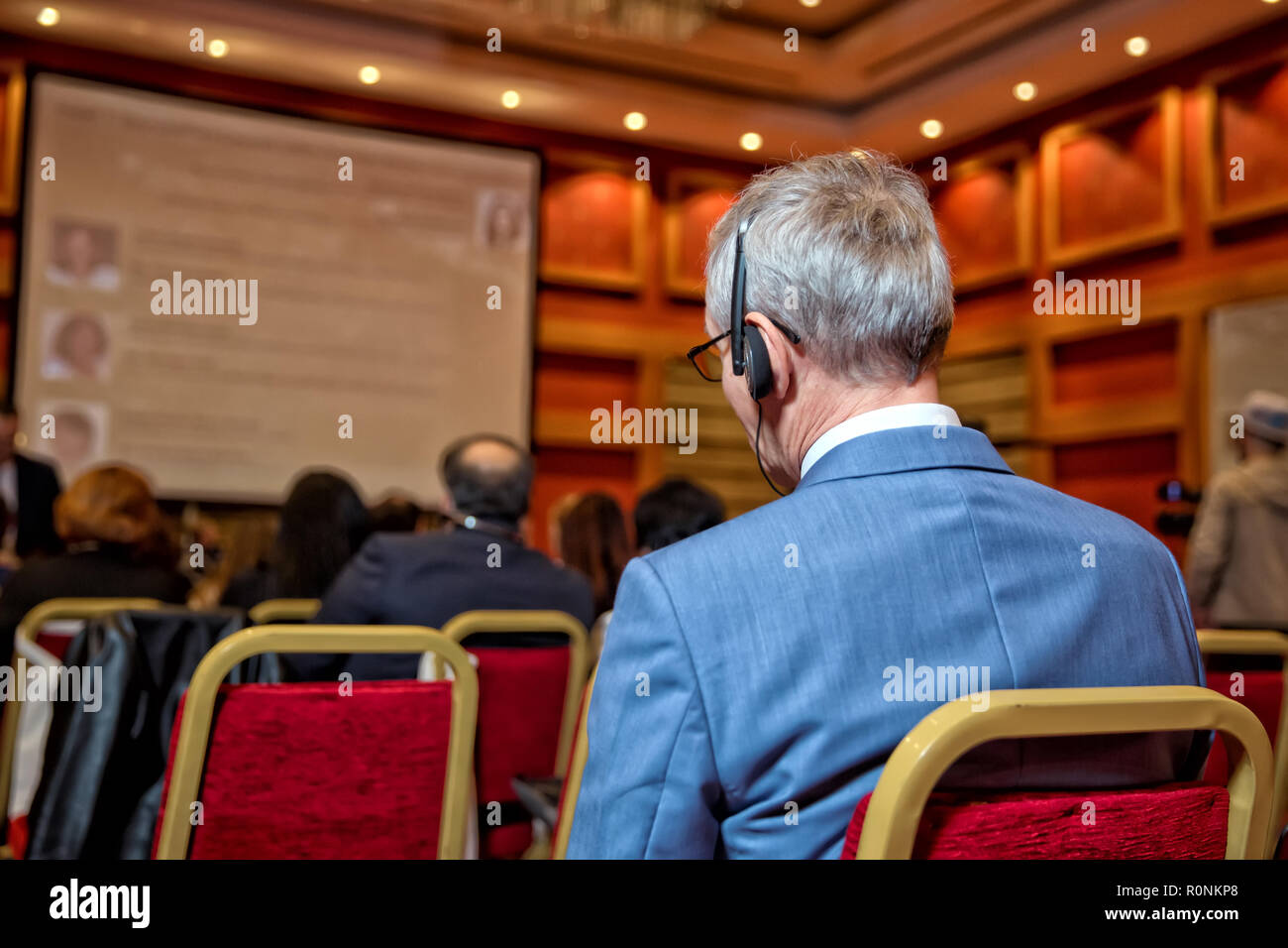 bald security guard with the headset to control people . heated debate ...