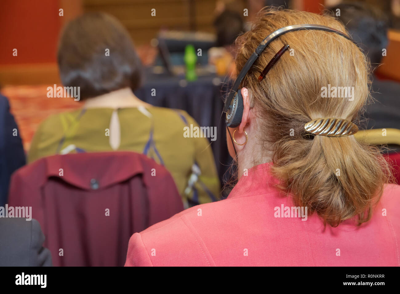 bald security guard with the headset to control people . heated debate ...