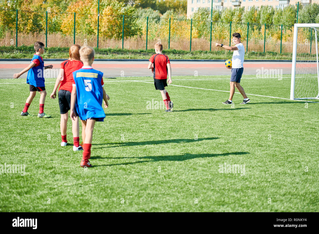 Football Team Practicing in Field Stock Photo - Alamy