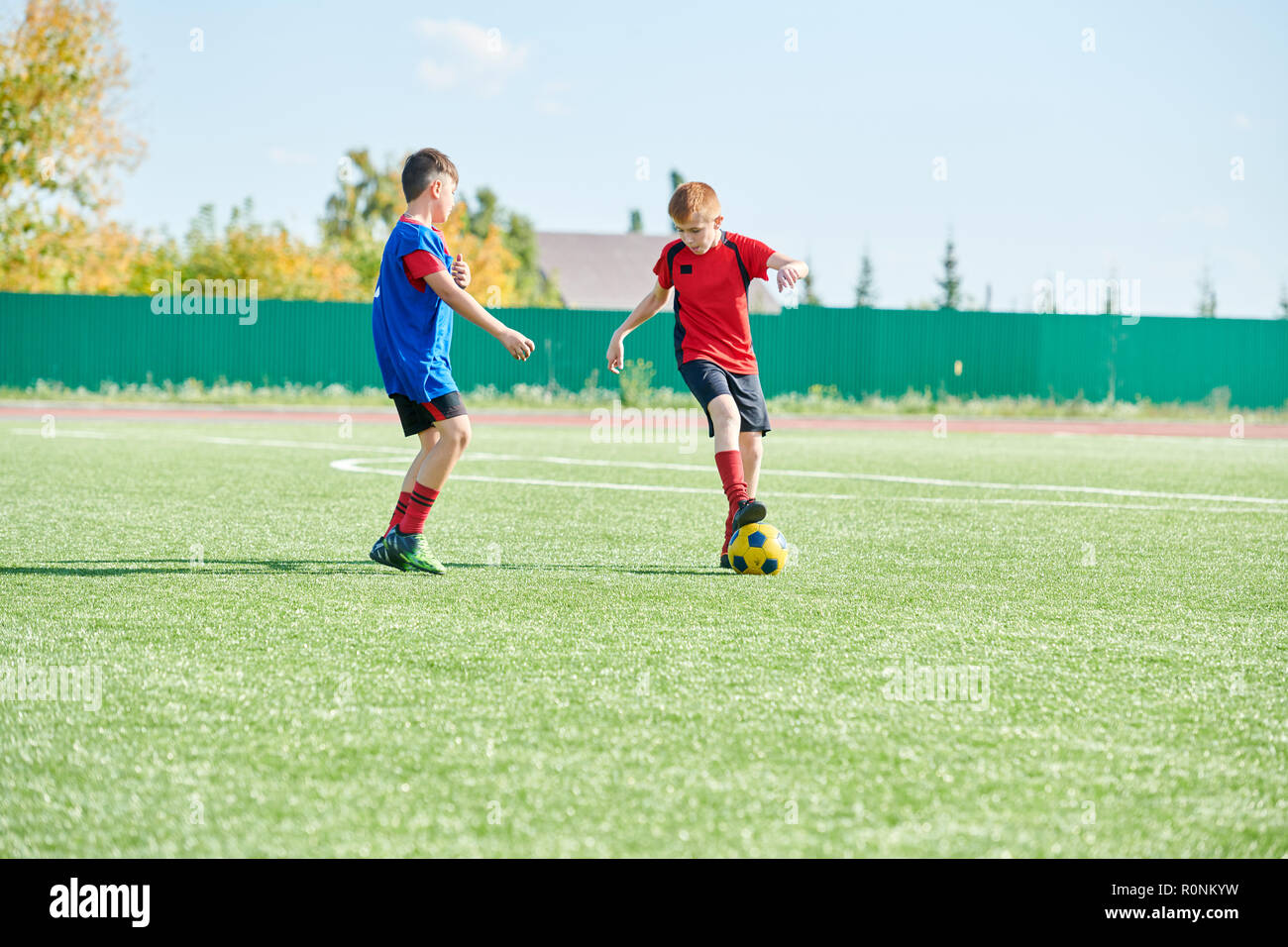 Boys Playing Football Stock Photo - Alamy