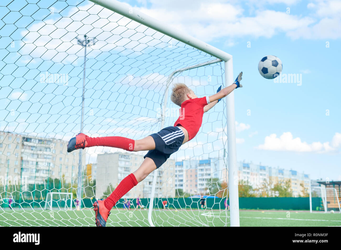 Child scoring goal hi-res stock photography and images - Alamy