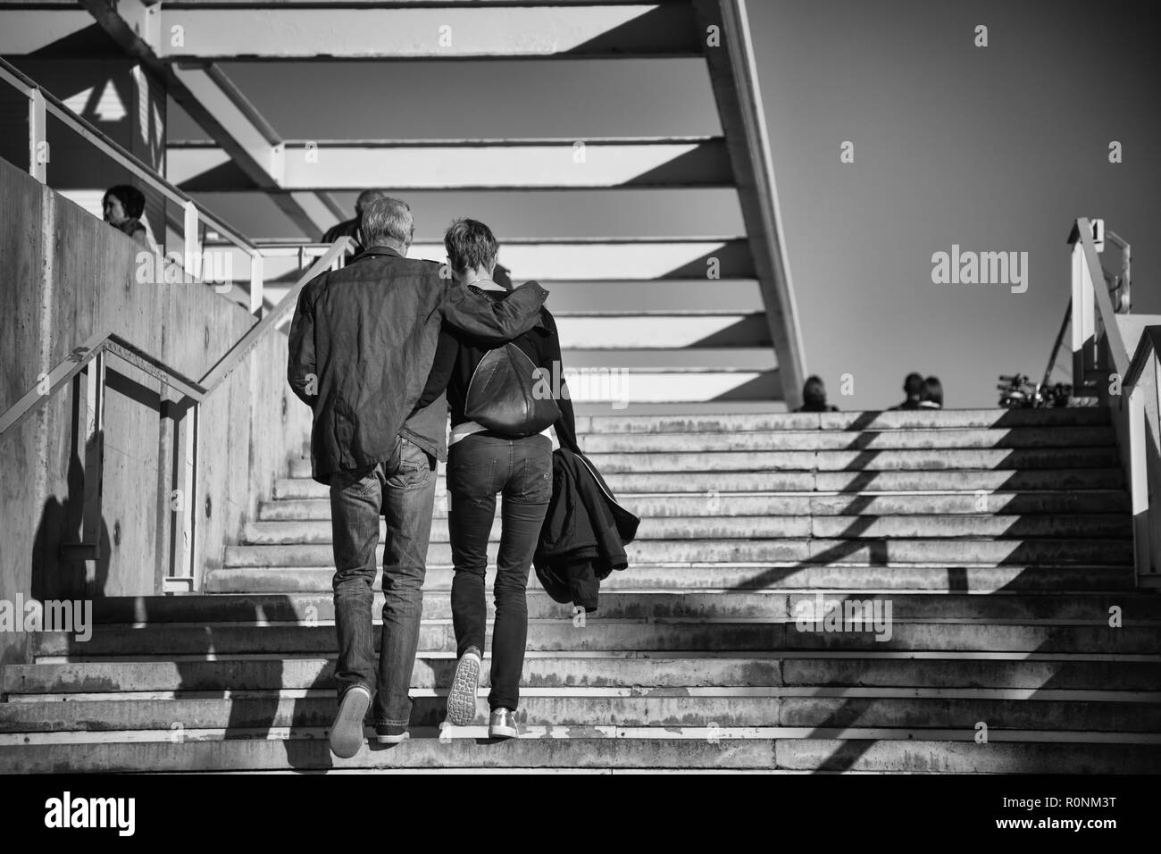 Holding hands walking up stairs hi-res stock photography and images - Alamy
