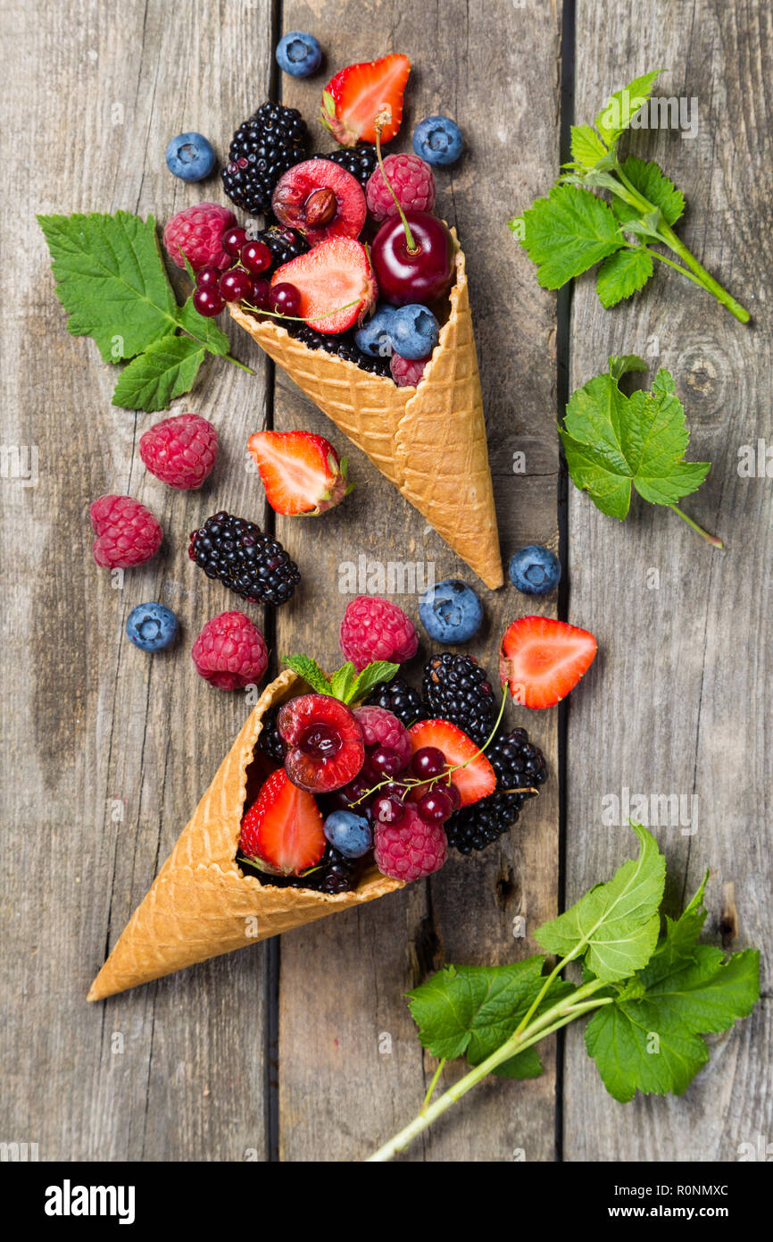 Selection of berries in ice cream cones - healthy dessert concept Stock ...