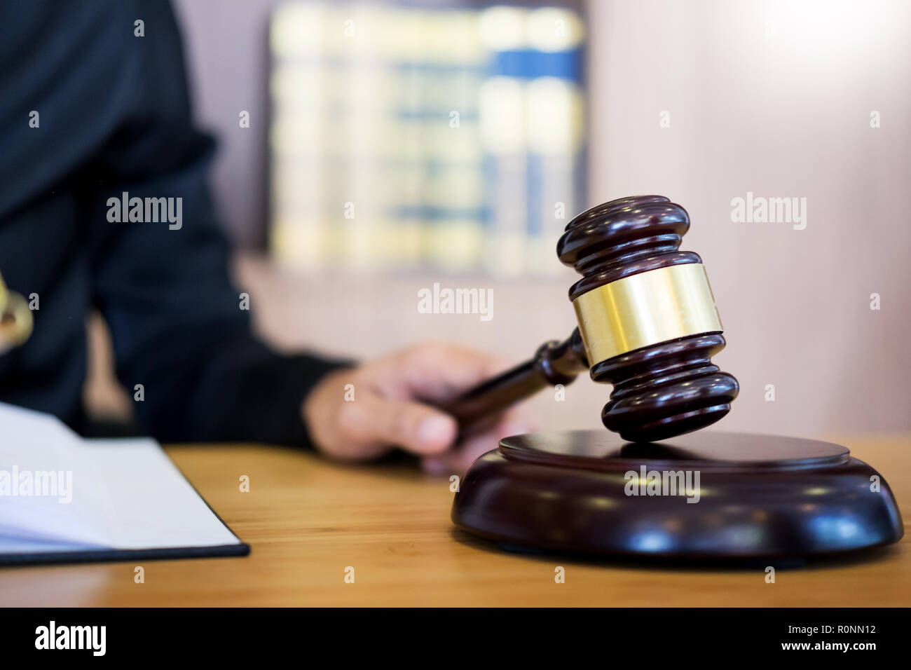 lawyer judge reading documents at desk in courtroom working on wooden ...