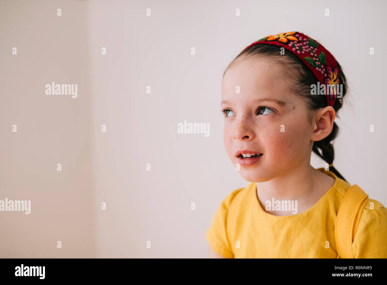 Portrait of a mischievous girl Stock Photo - Alamy