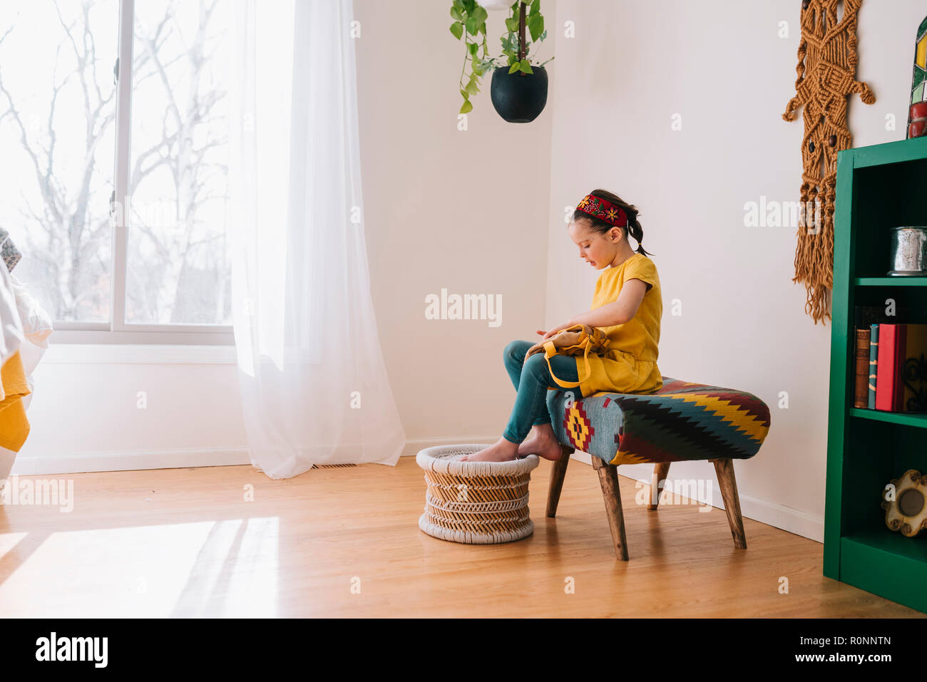 Girl on stool hi-res stock photography and images - Alamy