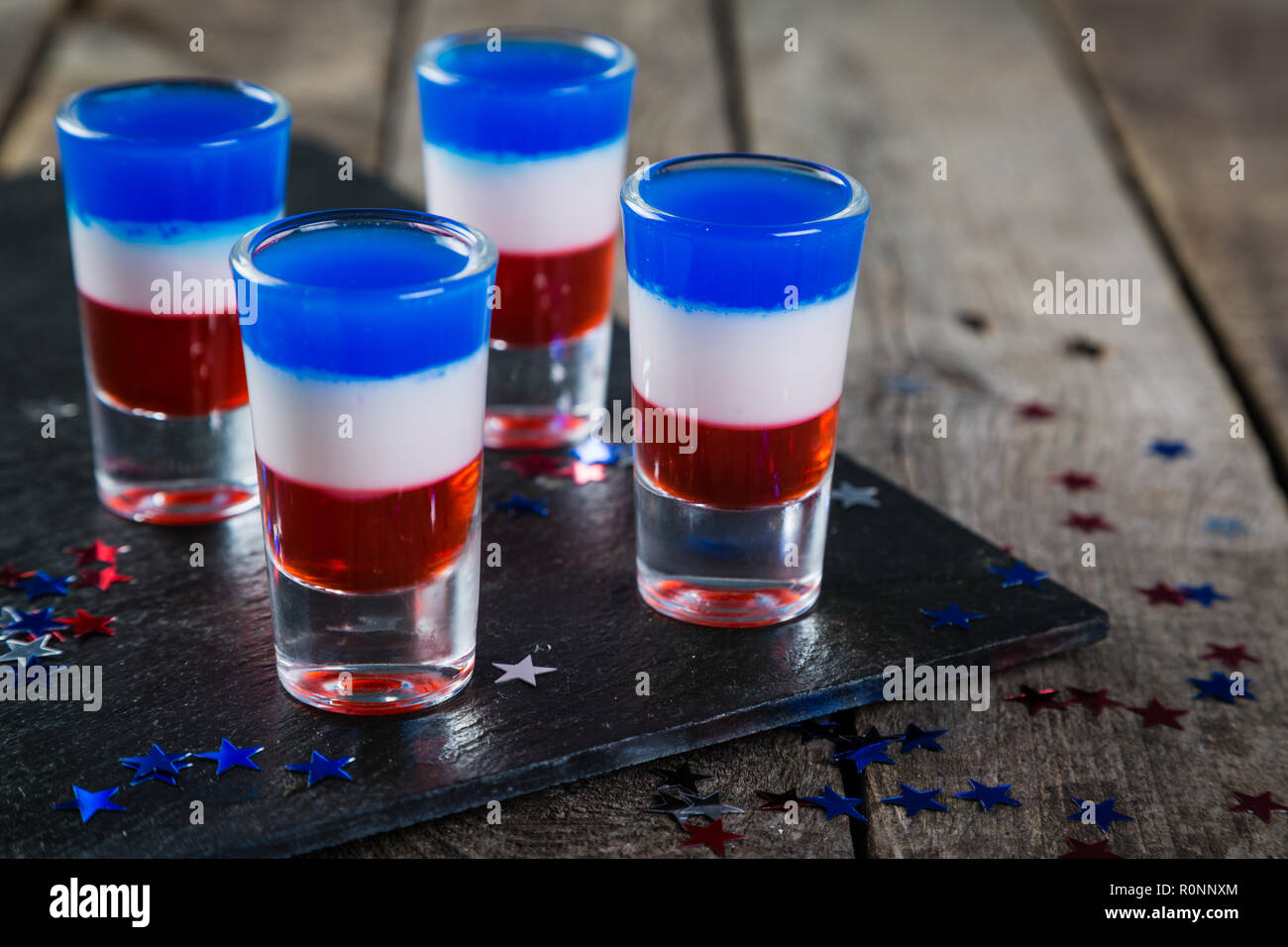 Independence day concept - flag coloured short cocktails on rustic ...
