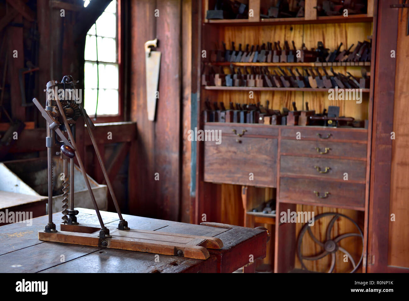 Inside Hancock Shaker Village woodworking workshop with barn beam drill ...