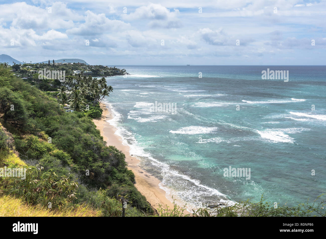 Sand beach and ocean in the coast along Diamond Head Road in Oahu ...