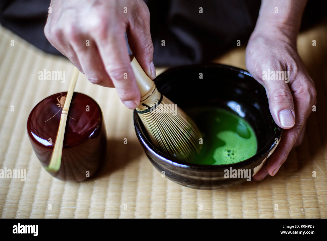 High angle close up of traditional Japanese Tea Ceremony, man using ...