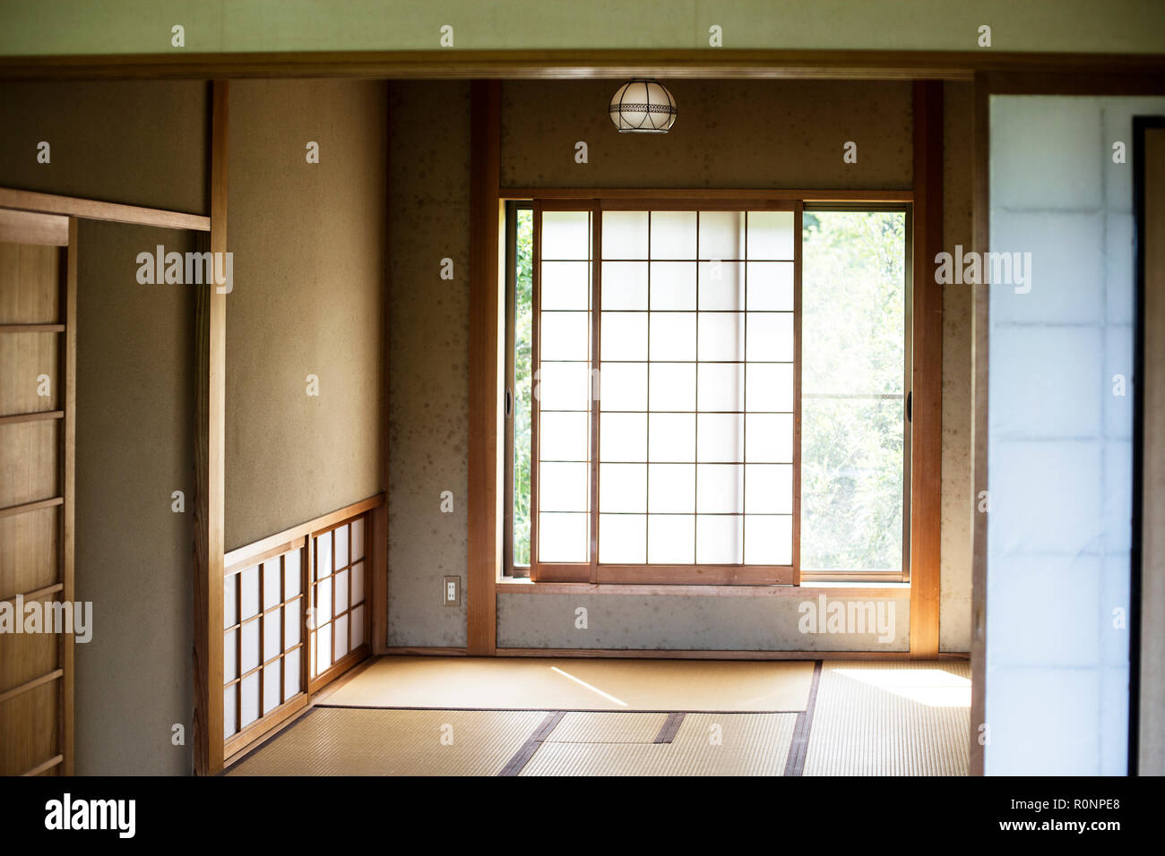 Interior of traditional Japanese house with tatami mats and opaque ...