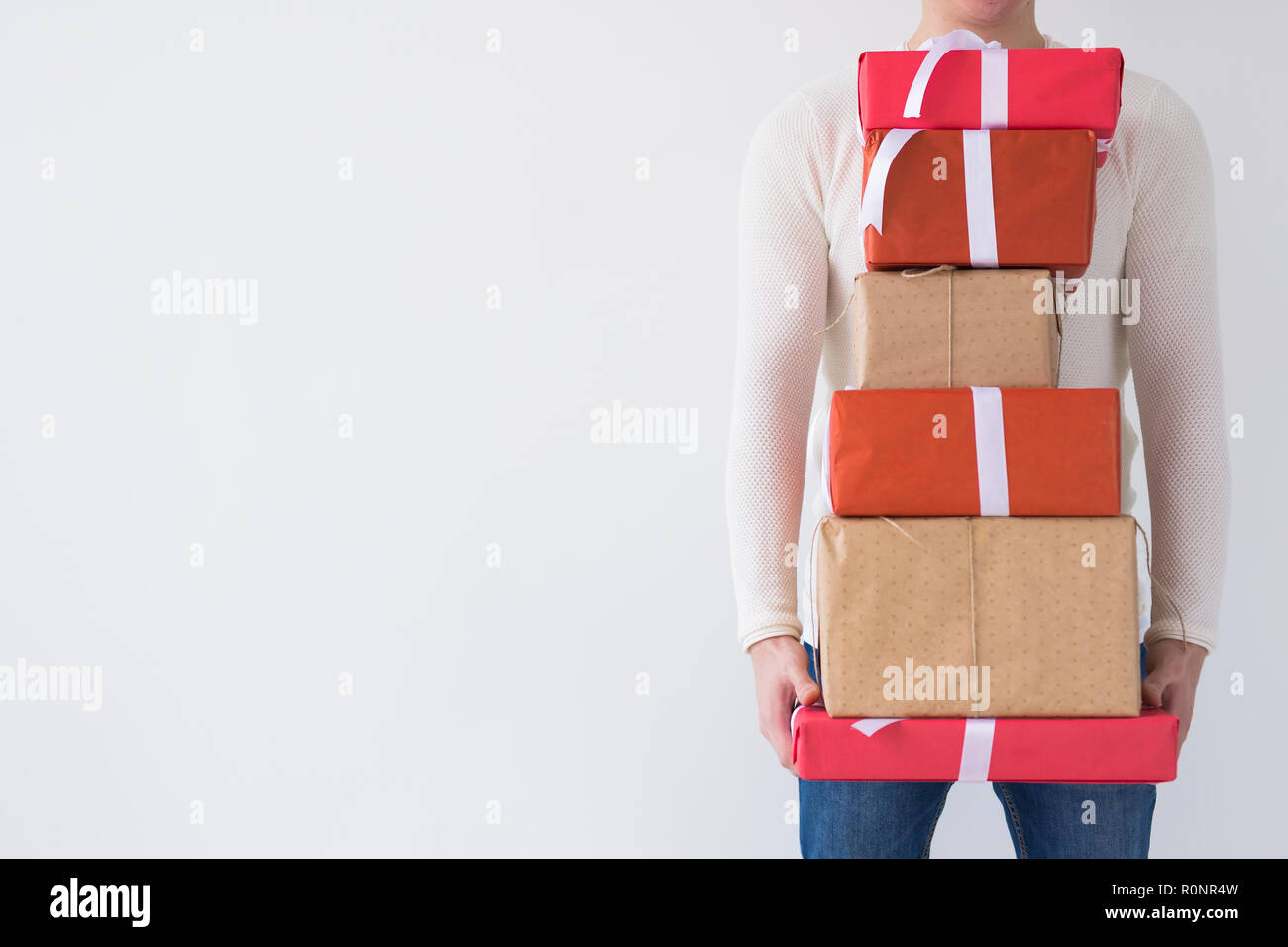 Christmas, holidays and presents concept - Close up of man holding a ...