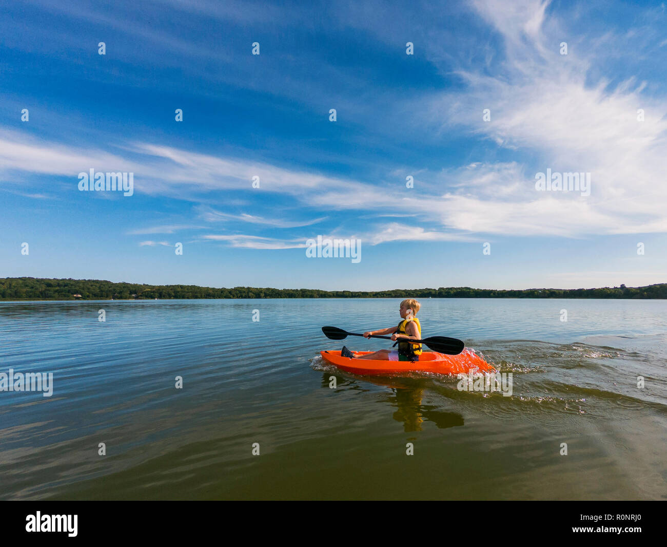 Boy kayaking in a lake, United States Stock Photo - Alamy