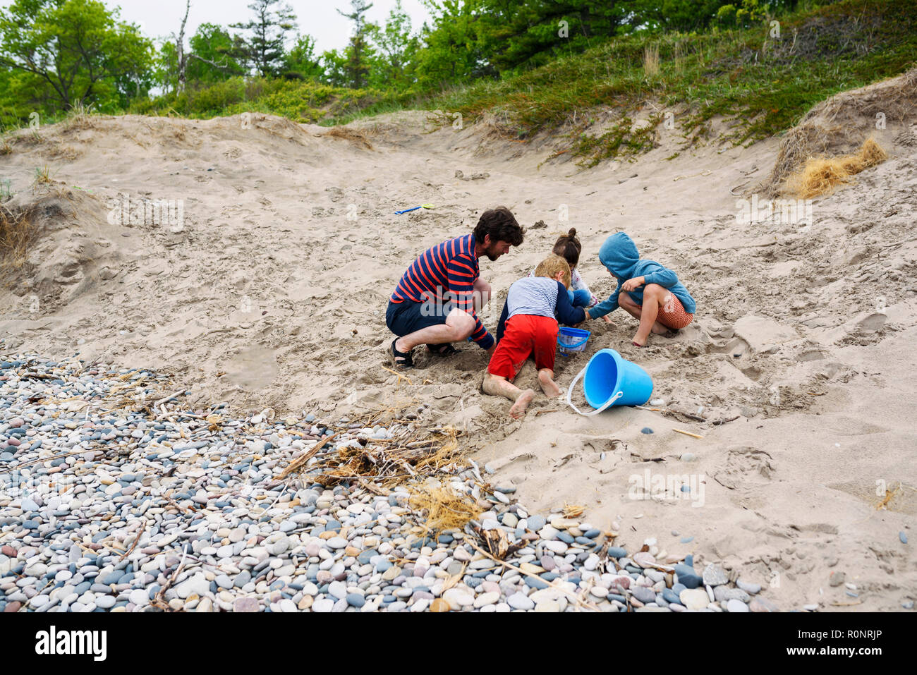 Boy building sandcastle on beach hi-res stock photography and images ...