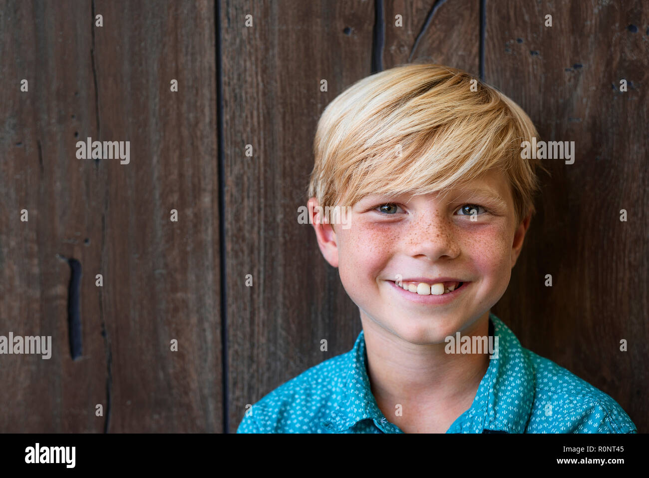 Portrait of a smiling boy with freckles Stock Photo - Alamy
