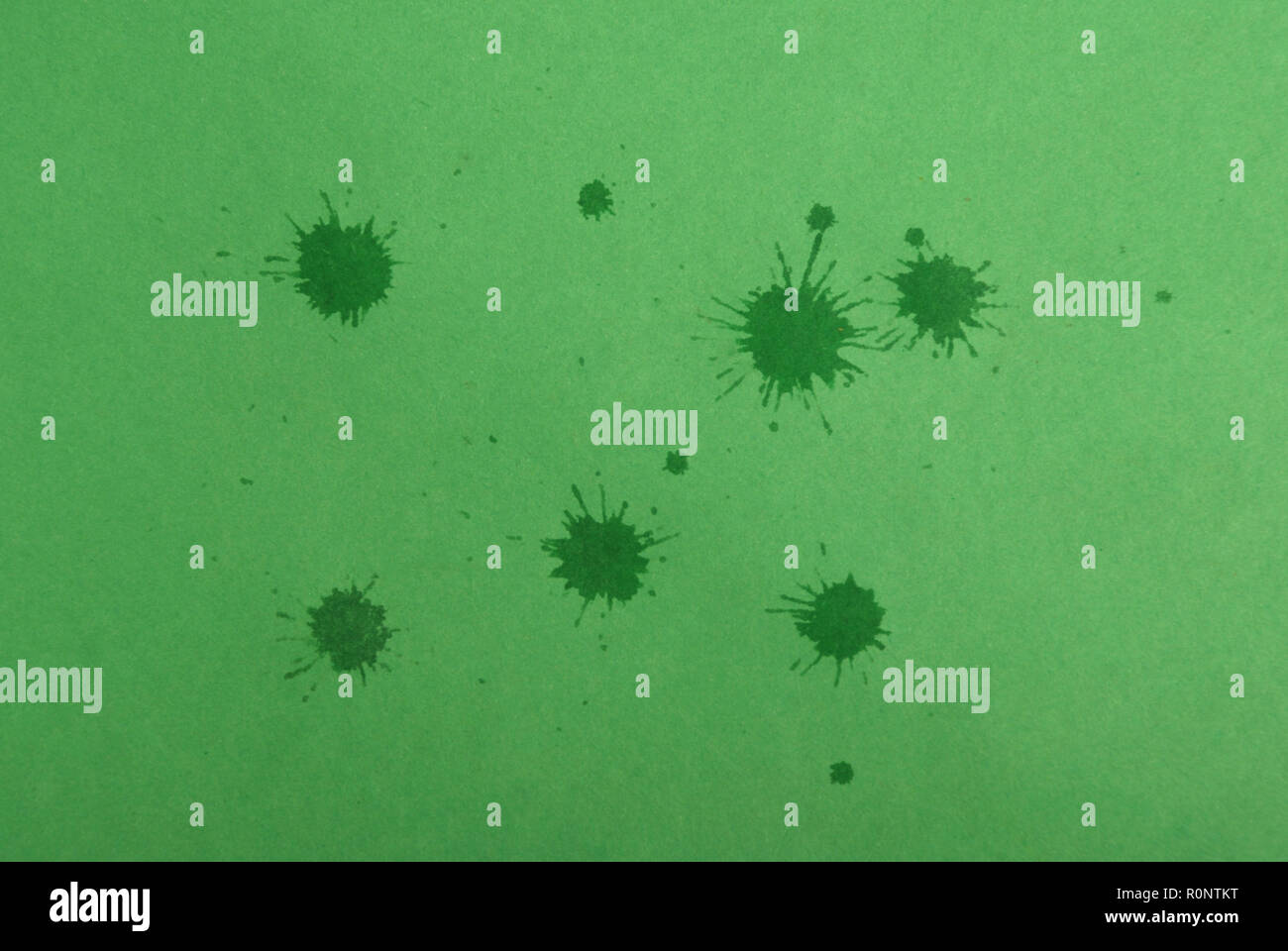 Green ink blots on green background close-up Stock Photo - Alamy