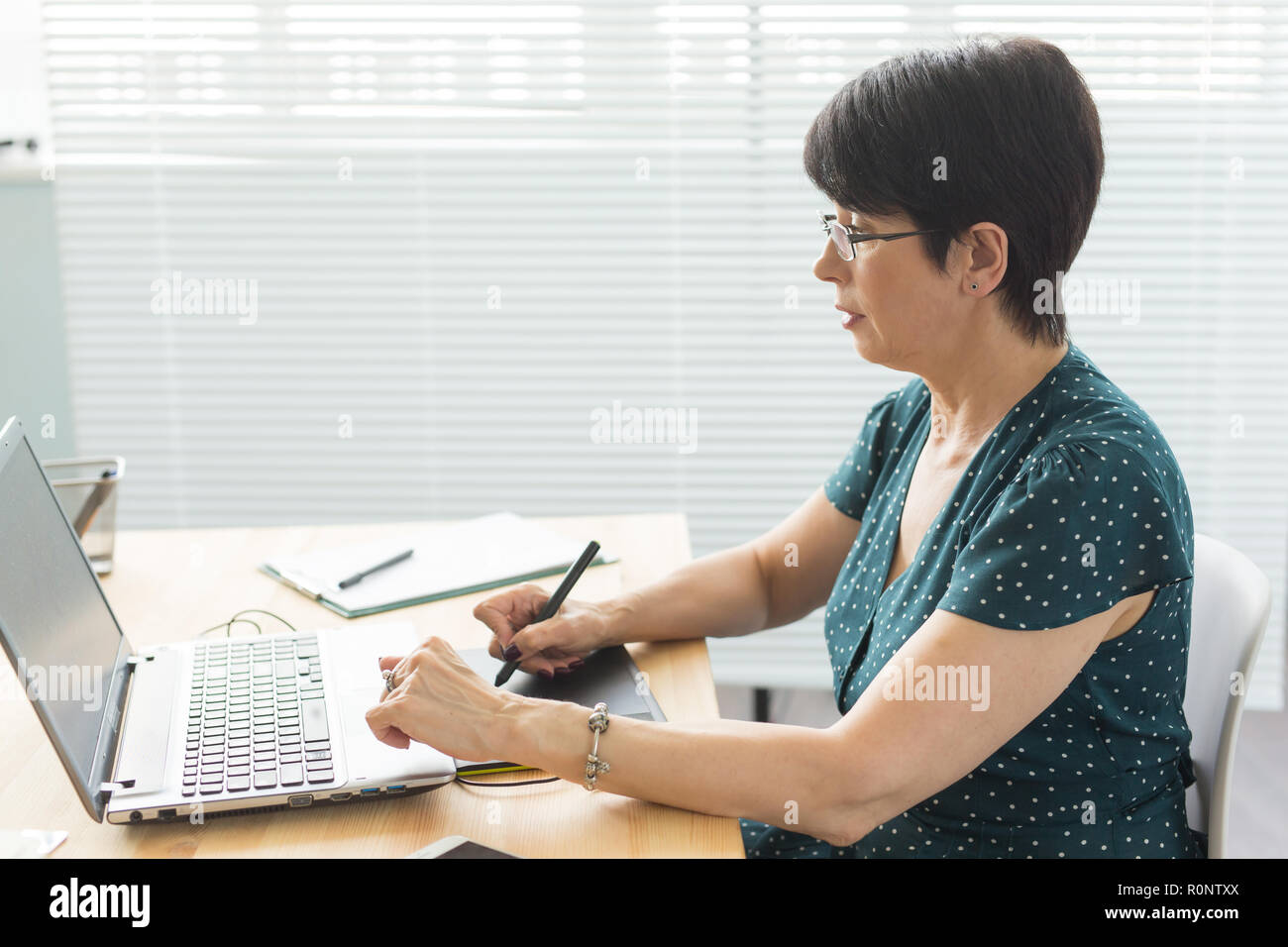 Office, graphic designer concept - Business woman hands holding digital ...