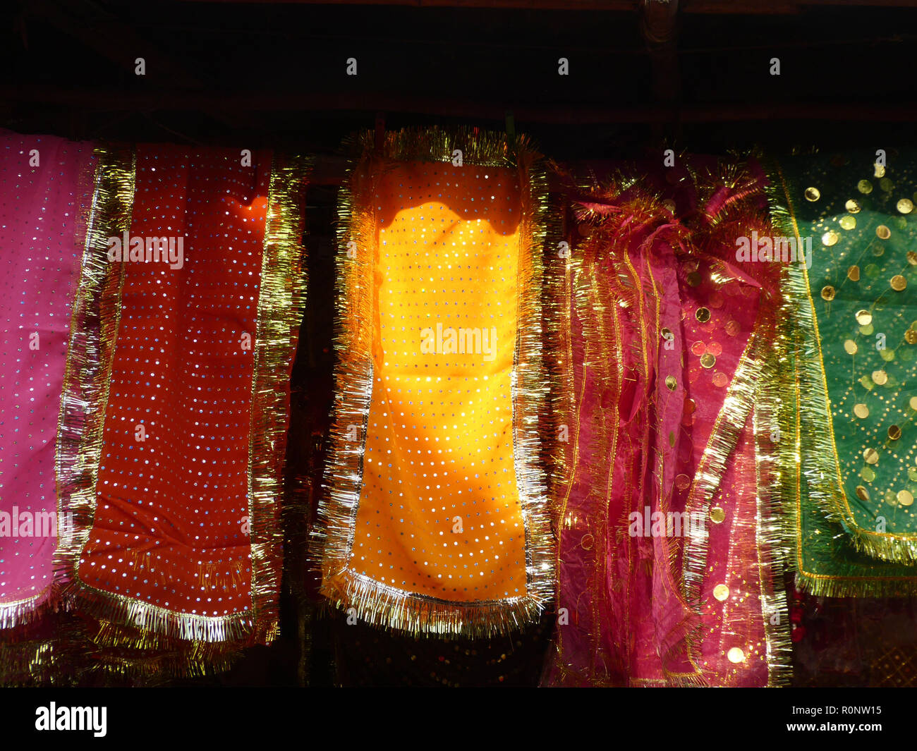 Multi-colored cloth hanging outside a mosque, New Delhi, India Stock ...