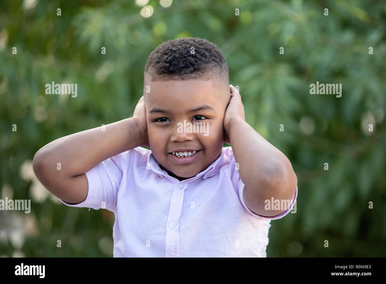 Child covering ears loud hi-res stock photography and images - Alamy