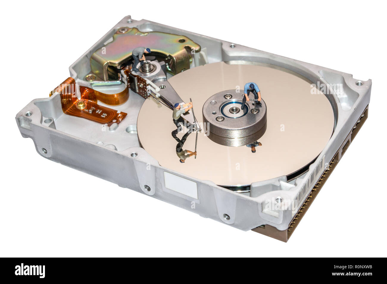 Creative concept with miniature people repairing the hard drive. A ...