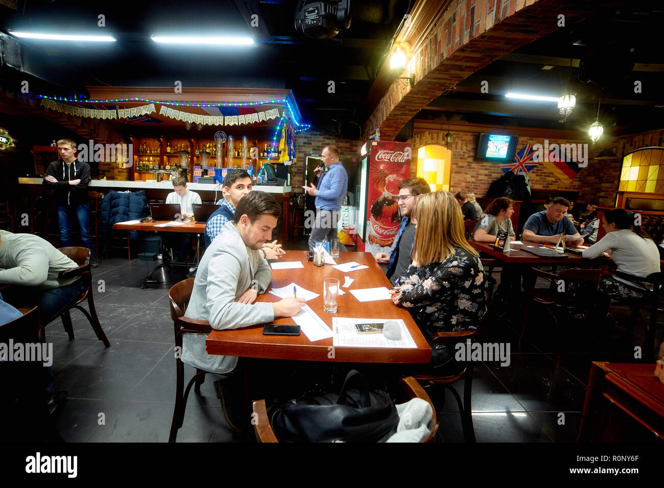 SYZRAN, RUSSIA - JANUARY 16, 2018: people sit in a bar at tables, eat ...