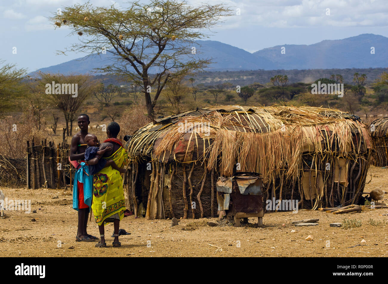 Samburu couple near their primitive hut, Samburu Game Reserve, Kenya ...
