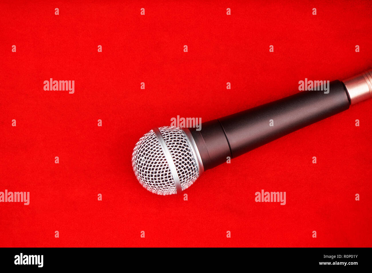 dynamic microphone on red floor for music background Stock Photo - Alamy