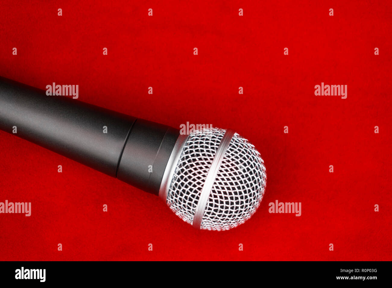 dynamic microphone on red floor for music background Stock Photo - Alamy