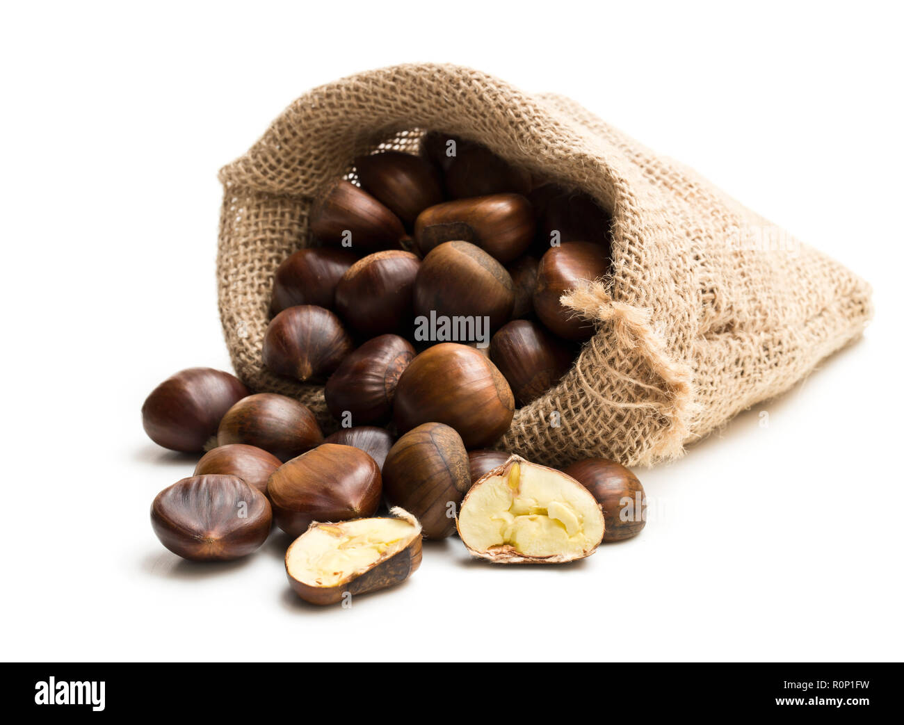 Fresh chestnuts in sack bag on white background Stock Photo - Alamy