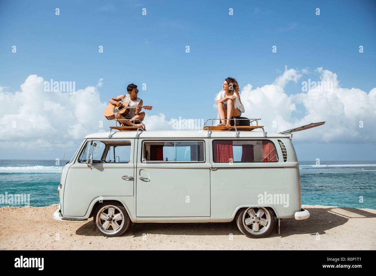Two people sit on roof hi-res stock photography and images - Alamy