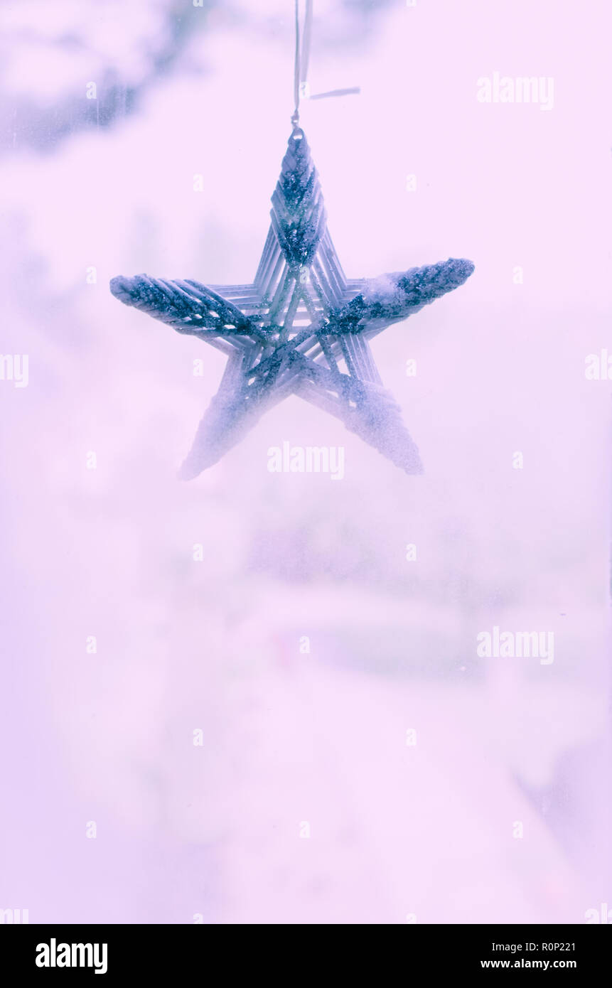 silver star decoration in the window copy space Stock Photo - Alamy