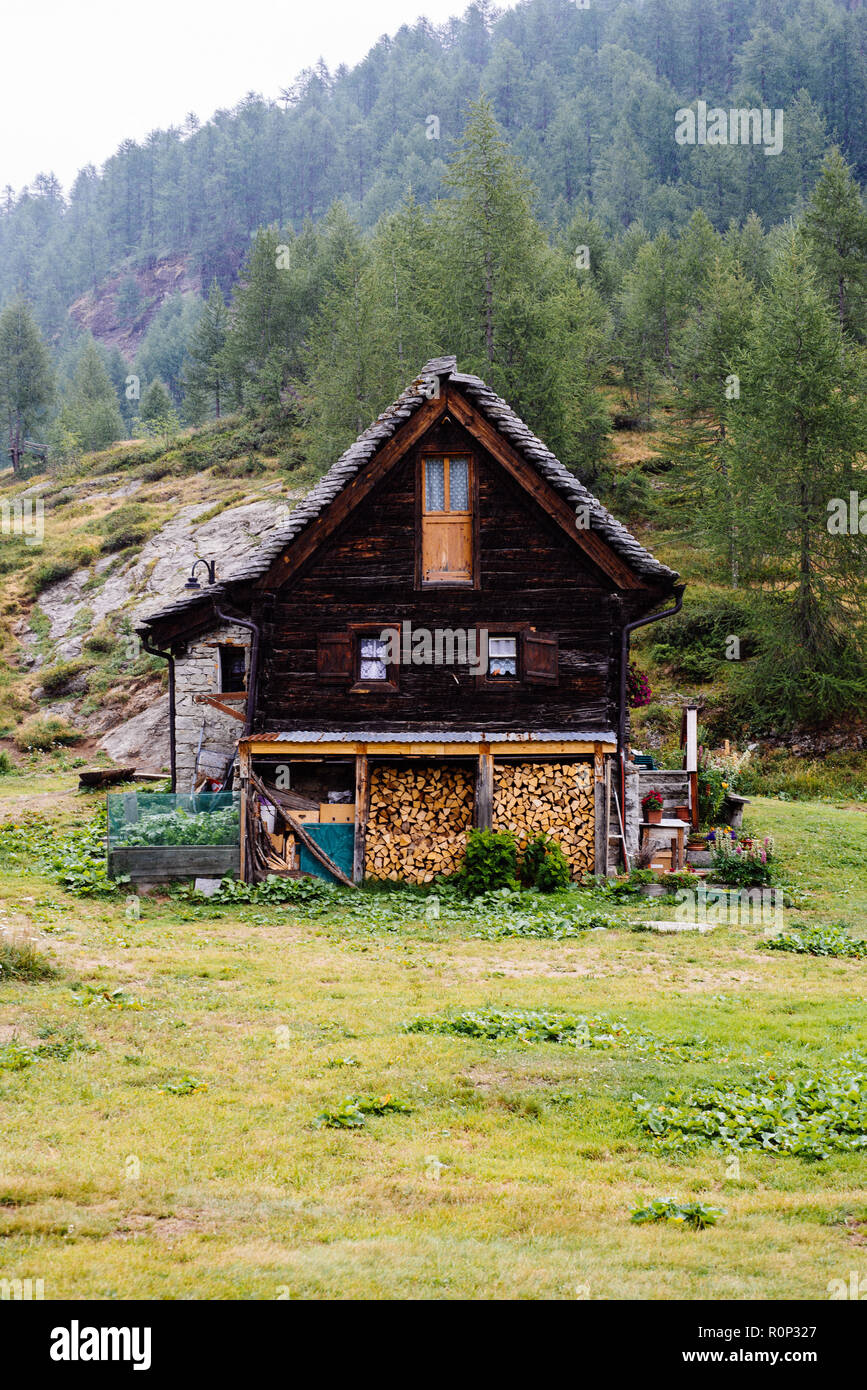 mountain house with flowers on the windows in the nature,Alpe Devero ...
