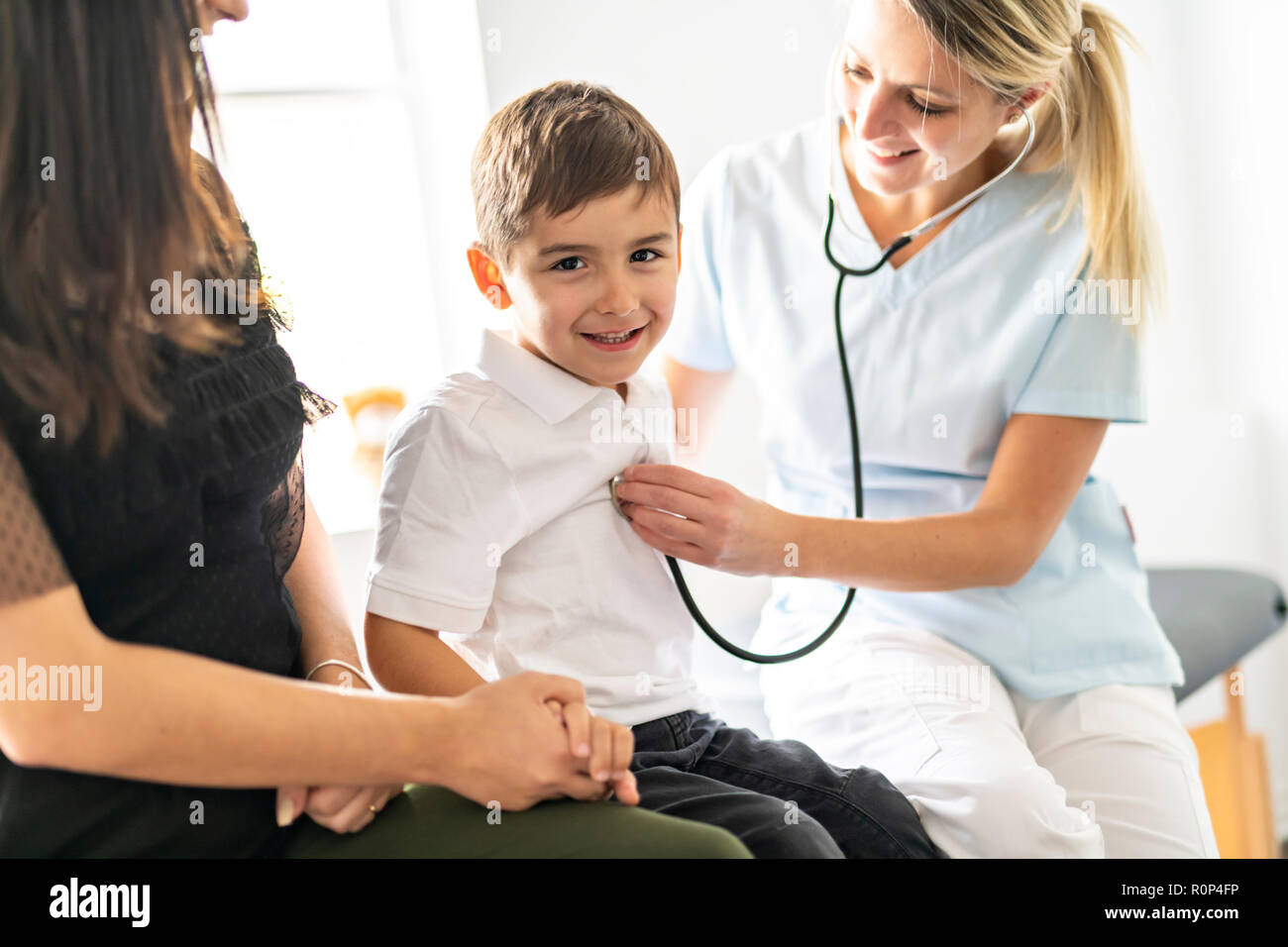 A cute Child Patient Visiting Doctor's Office Stock Photo - Alamy