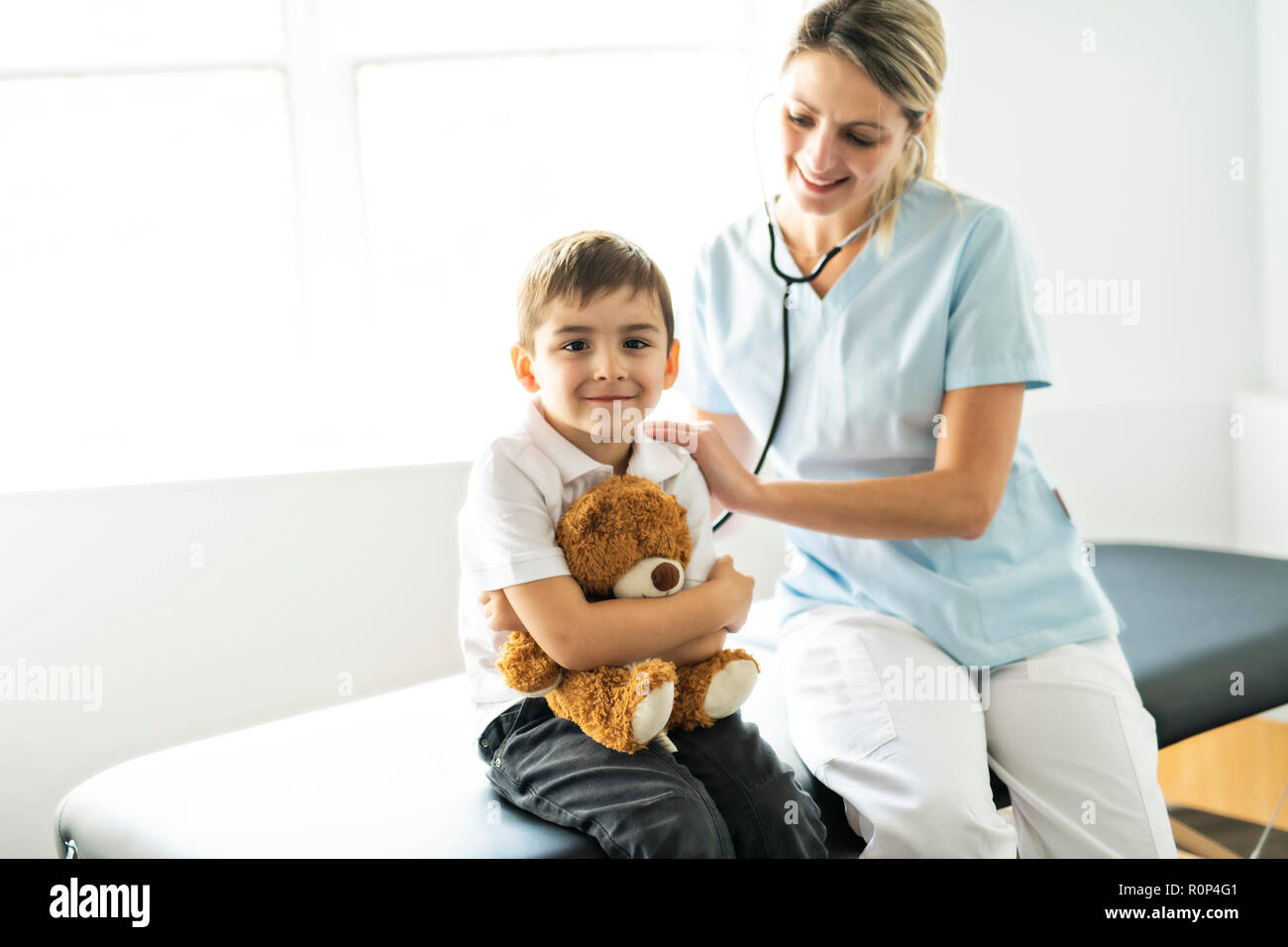 A cute Child Patient Visiting Doctor's Office Stock Photo - Alamy