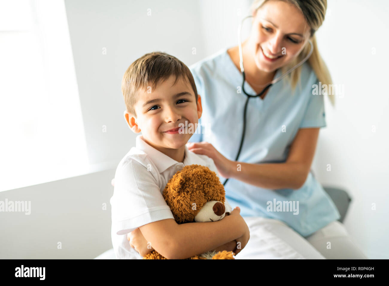 A cute Child Patient Visiting Doctor's Office Stock Photo - Alamy