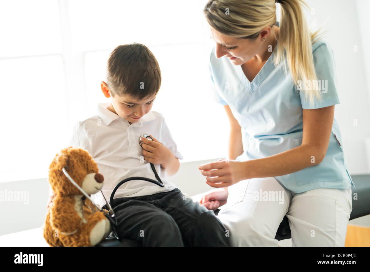 A cute Child Patient Visiting Doctor's Office Stock Photo - Alamy