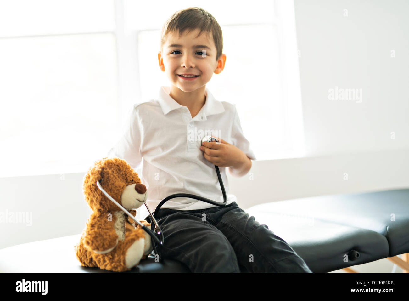 Boy playing doctor hi-res stock photography and images - Alamy