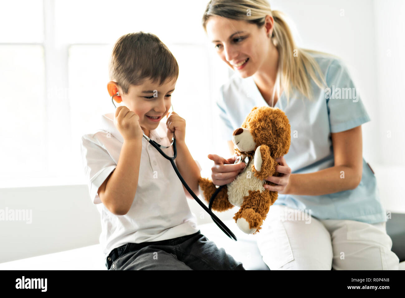 A cute Child Patient Visiting Doctor's Office Stock Photo - Alamy