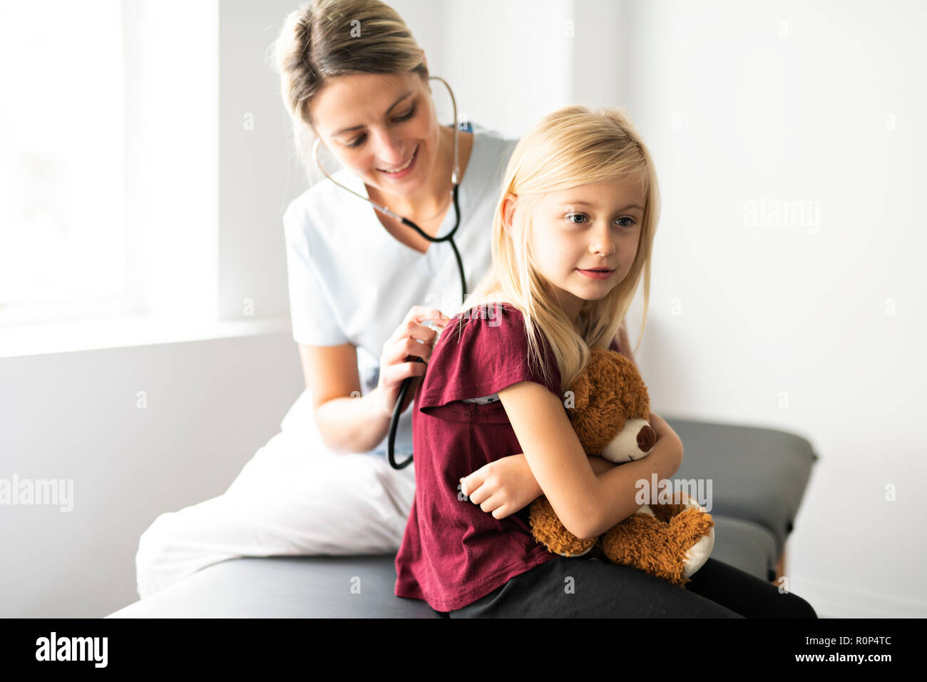 A cute Child Patient Visiting Doctor's Office Stock Photo - Alamy