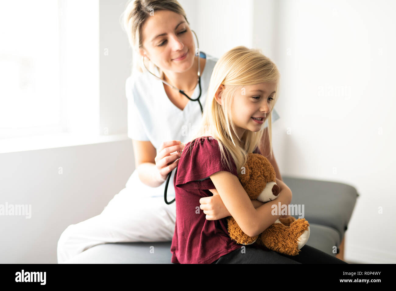 A cute Child Patient Visiting Doctor's Office Stock Photo - Alamy