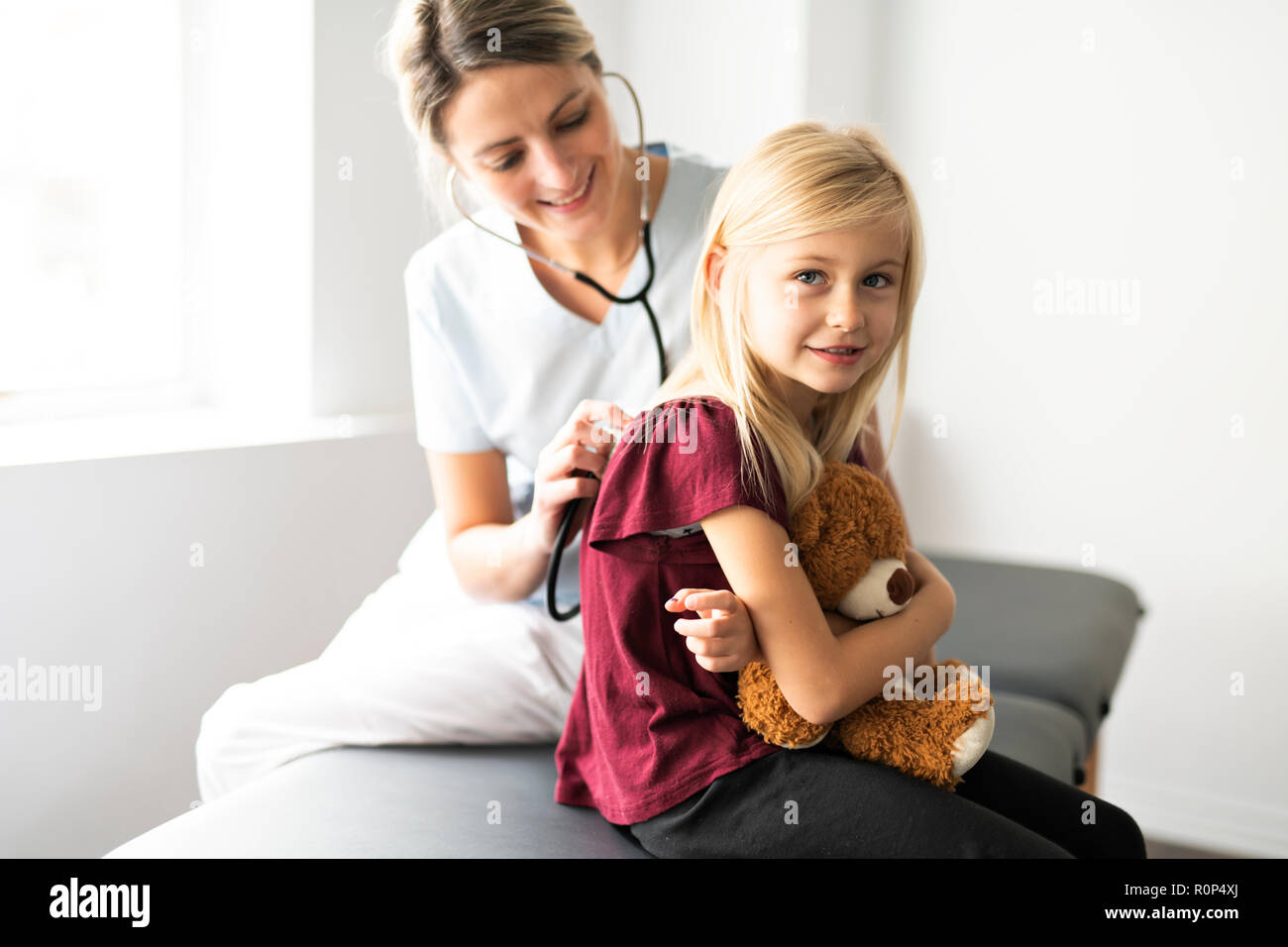 A cute Child Patient Visiting Doctor's Office Stock Photo - Alamy