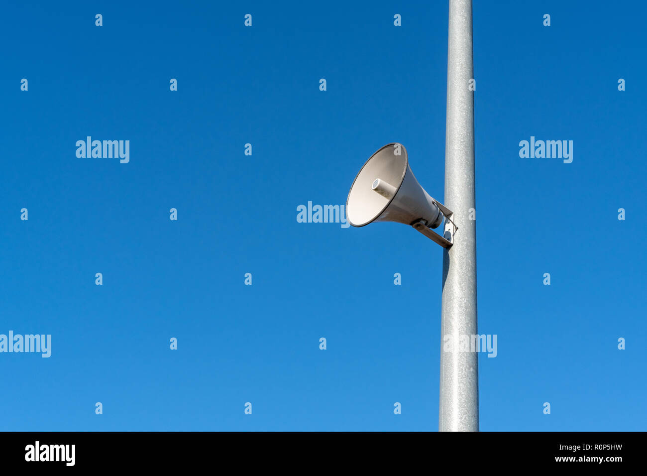 Outdoor stadium loudspeaker over blue sky background Stock Photo - Alamy