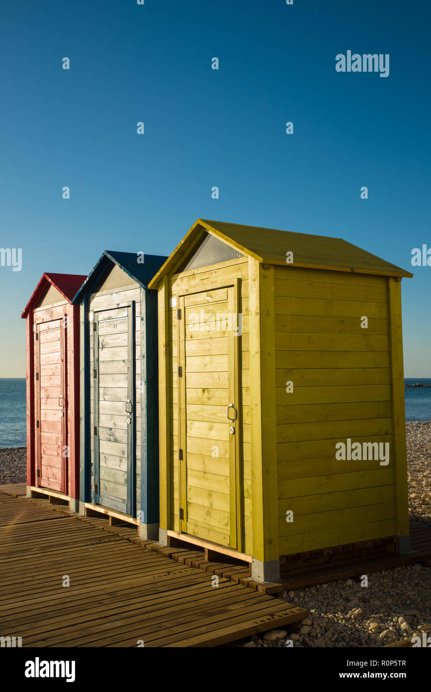 Several multicolored huts on a Mediterranean resort beach Stock Photo ...