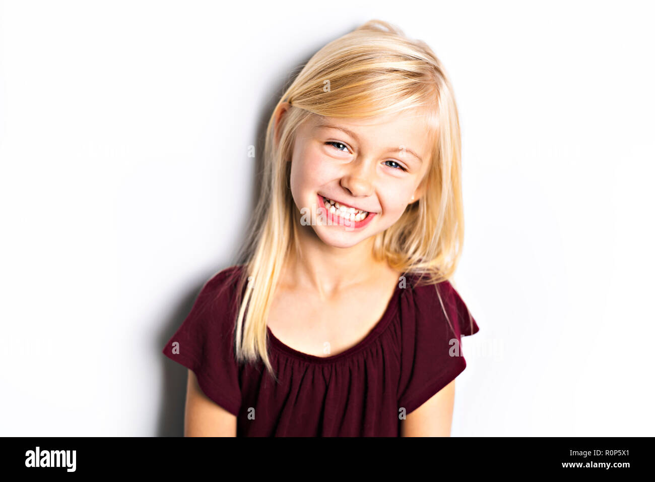 A Cute girl 5 year old posing in studio Stock Photo - Alamy