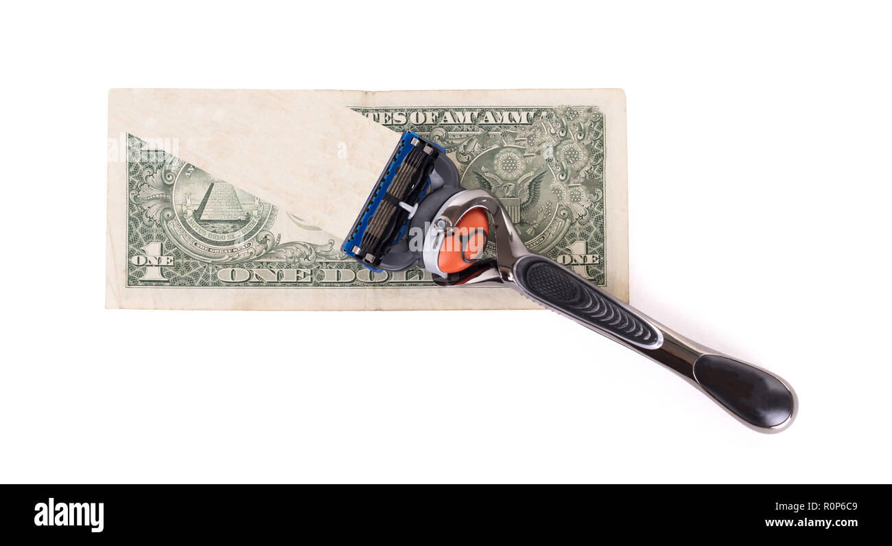 Dollar with a razor blade - Isolated on white Stock Photo - Alamy