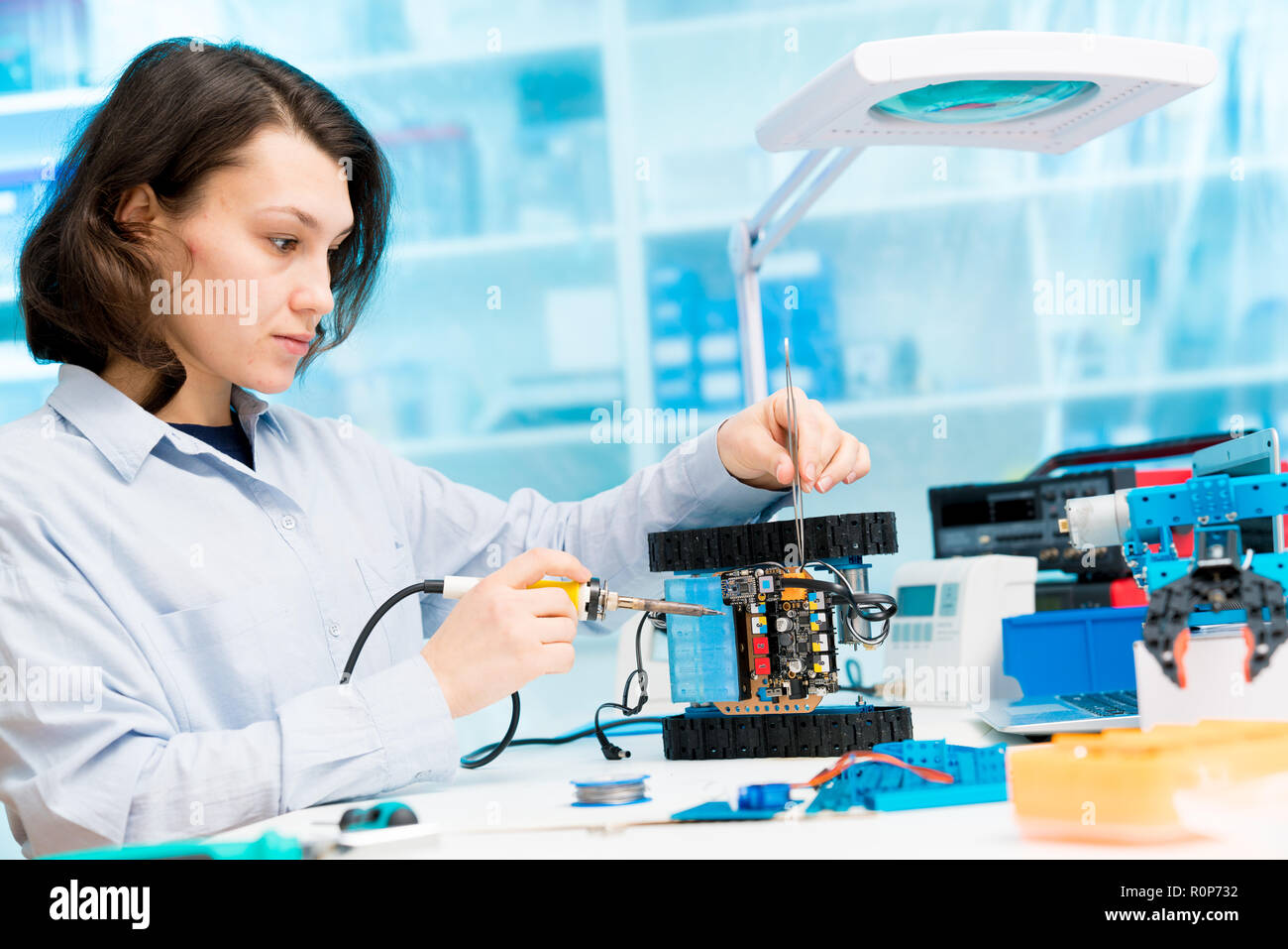 Young woman in CNC and robotics laboratory Stock Photo - Alamy