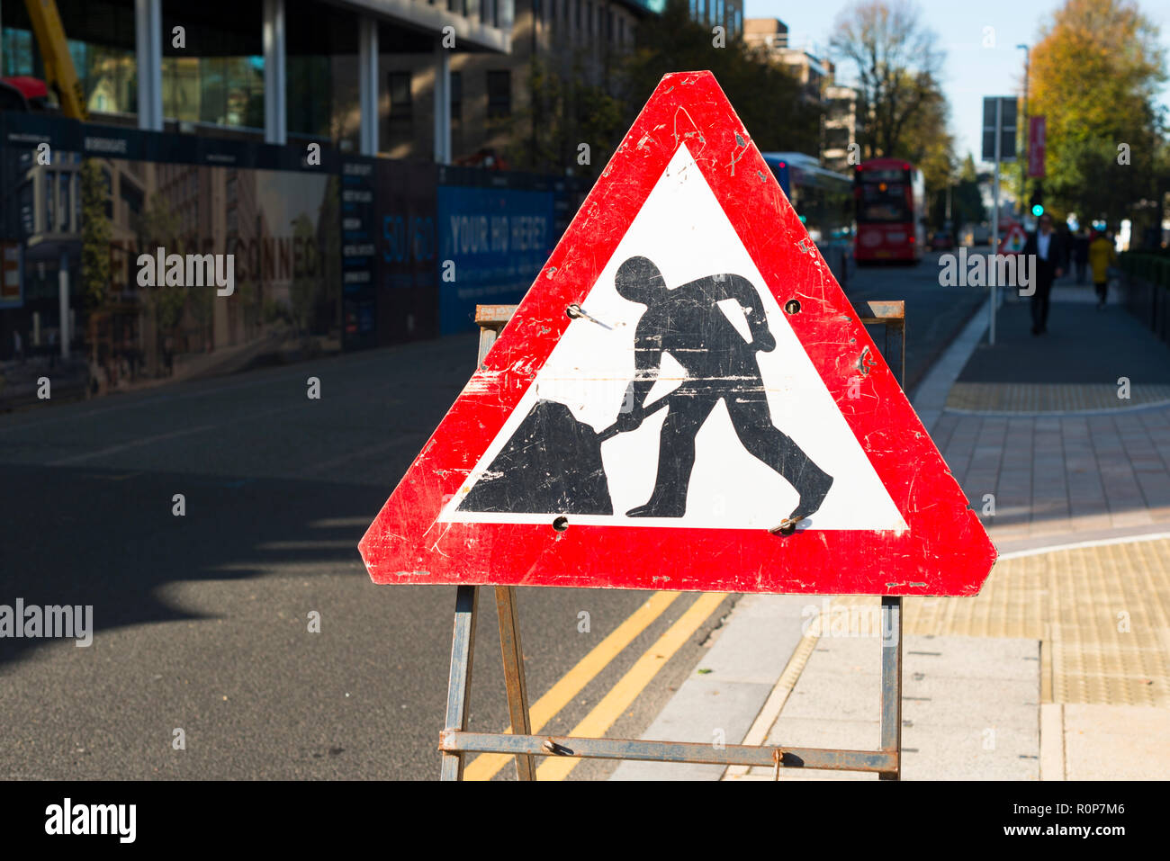Men at work street sign with building site to the rear. Cambridge ...