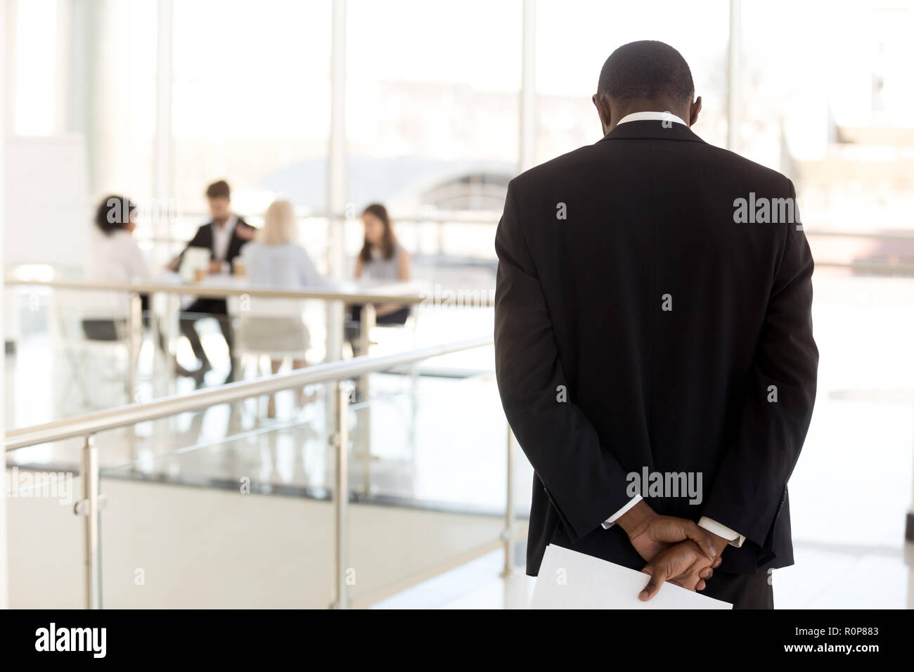 Nervous black employee waiting in hallway before entering meetin Stock ...