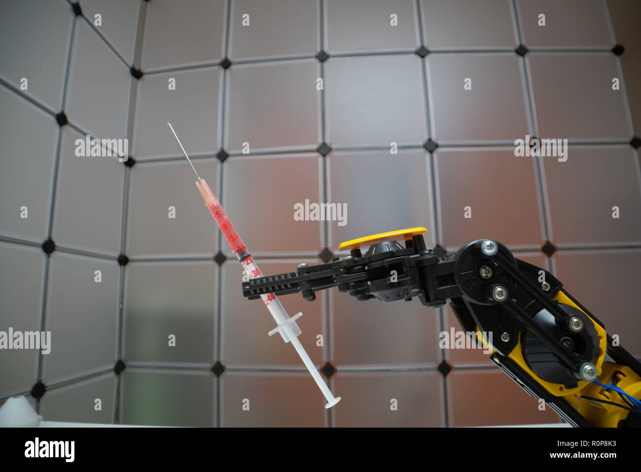 robot arm with medical syringe Stock Photo - Alamy
